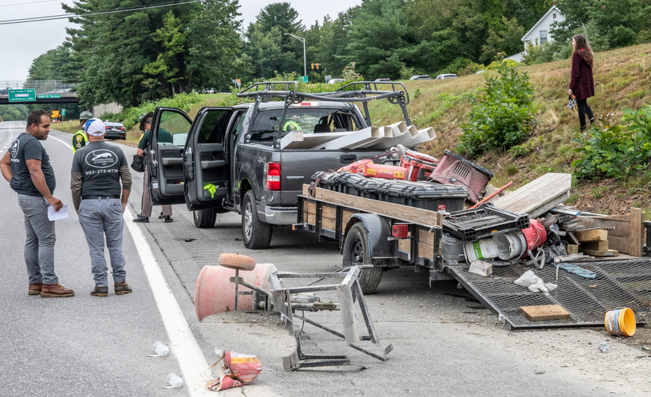 Section of Everett Turnpike guard rail impales vehicle, trapping driver ...